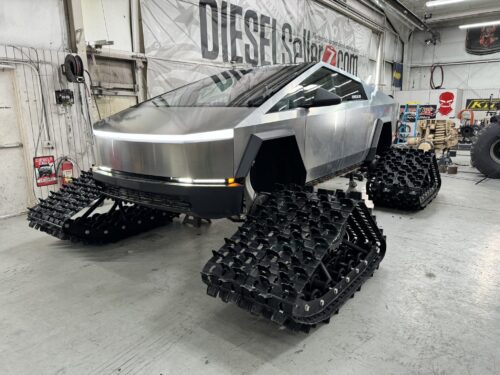 Custom Cybertruck plows through snow with crazy track wheels