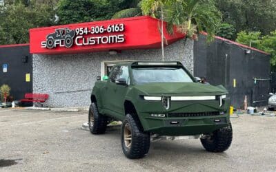 Rivian pick-up truck customized with 'moss' body kit