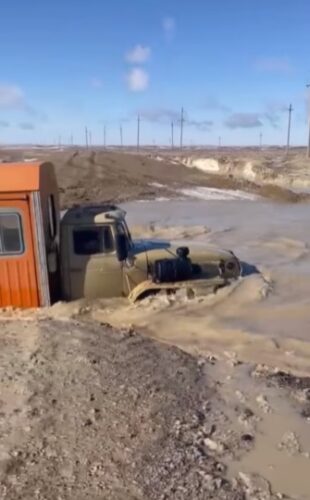 Russian bus driver attempts to cross a river and regrets it