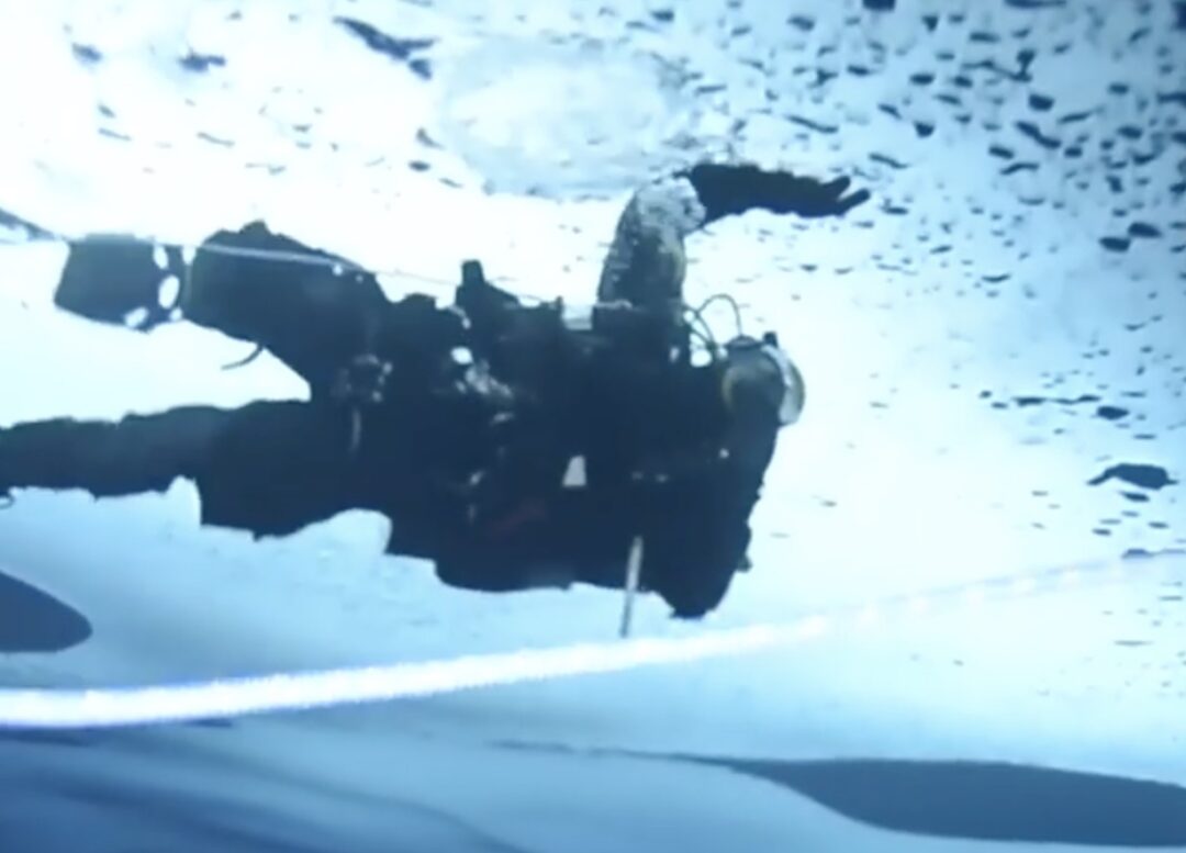 Watch this $2 billion submarine emerge from a thick layer of ice ...