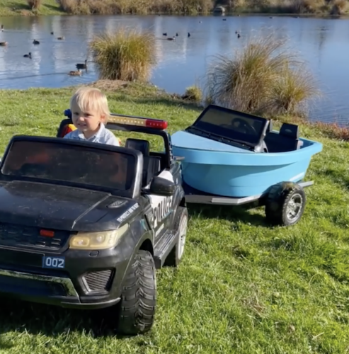 Video shows toddler driving a boat to a lake and sailing it