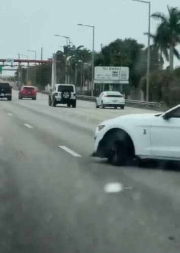 Fishtailing Mustang driver skillfully avoids hitting McLaren