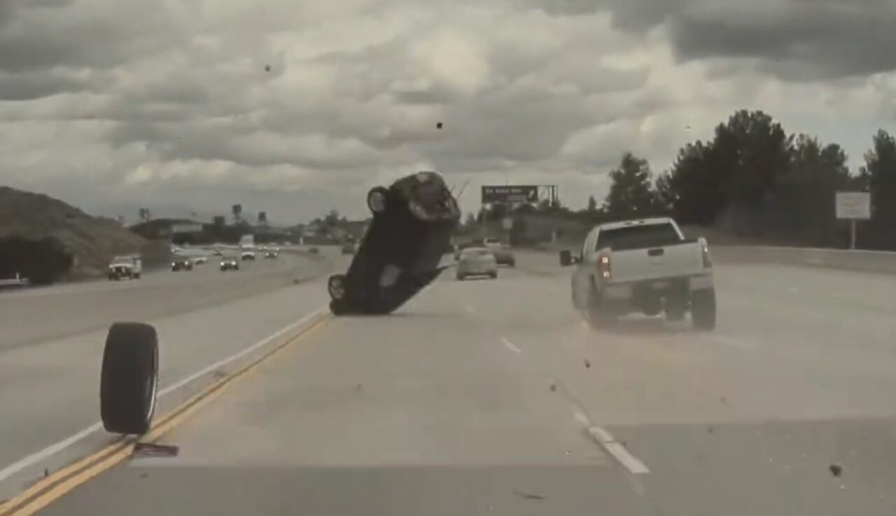 Footage shows runaway tire launching Kia Soul into the air
