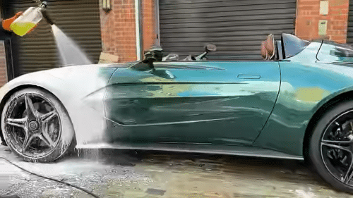 Man goes round London cleaning the street-parked supercars