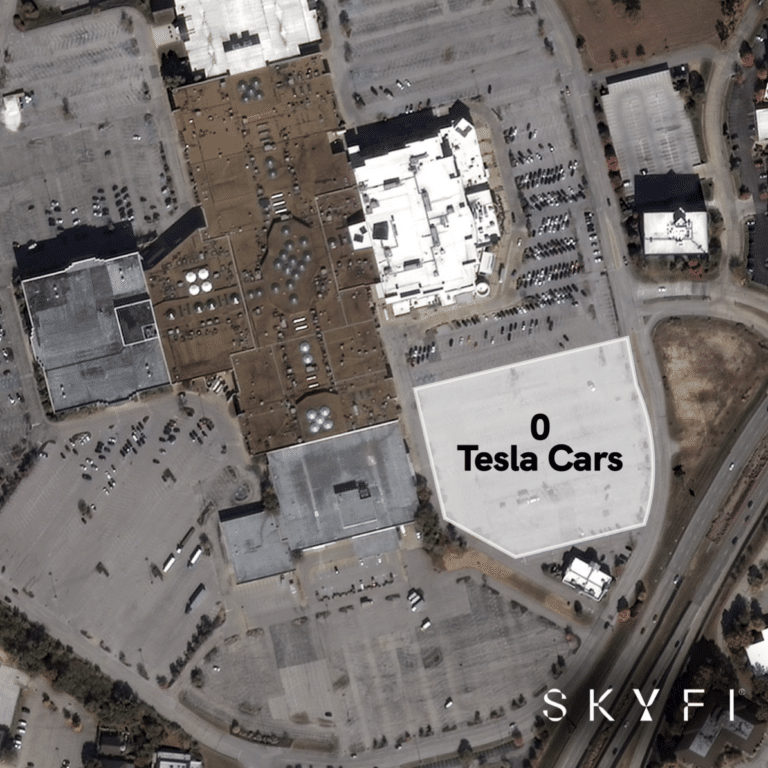 Unsold Tesla units filling parking lots seen from space